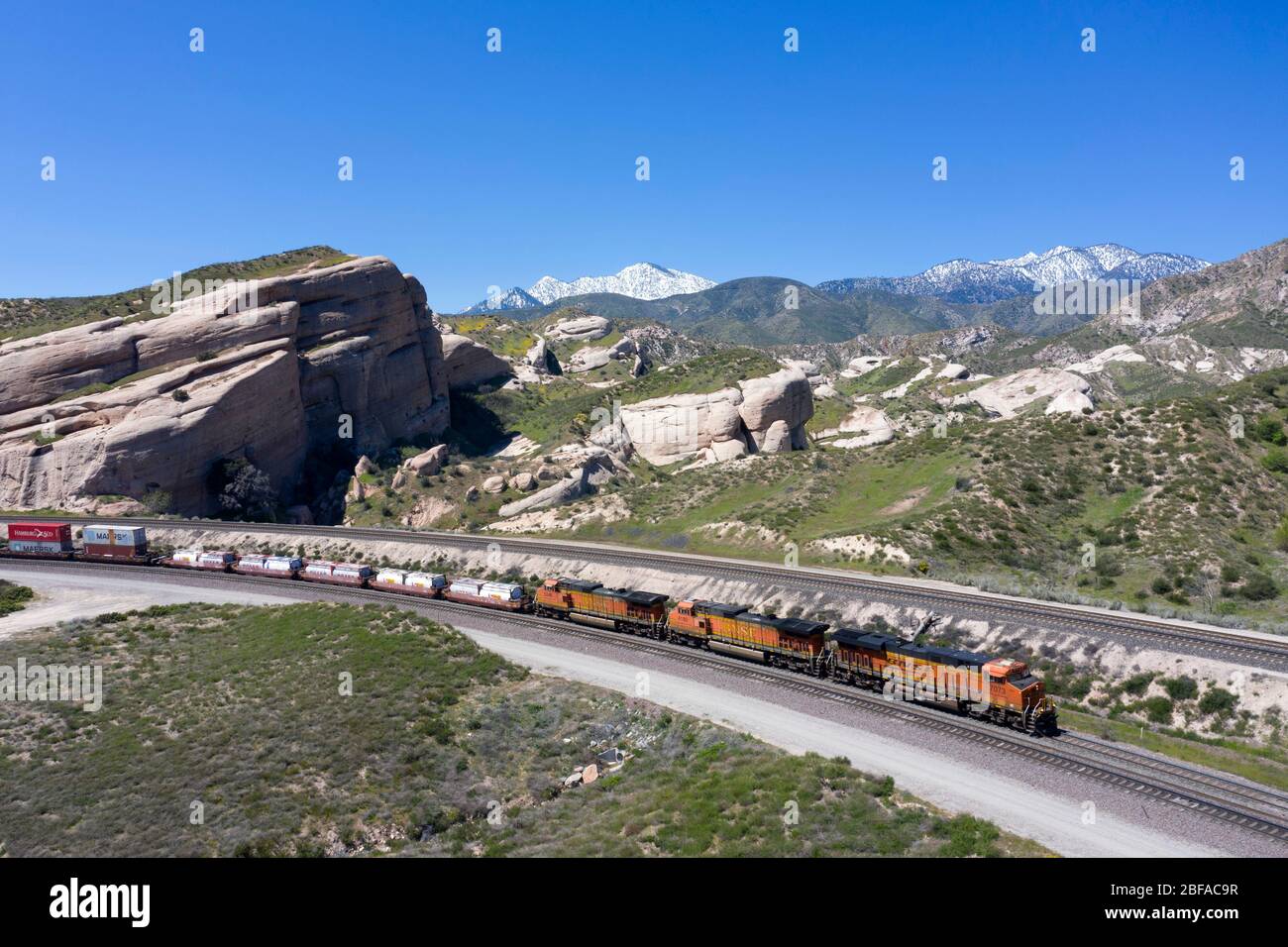 Freight train climbing the grade at Cajon Pass in San Bernardino County, part of the large ...