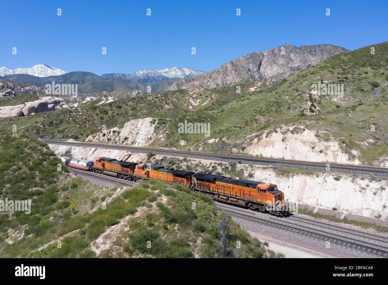 Freight train climbing the grade at Cajon Pass in San Bernardino County, part of the large ...