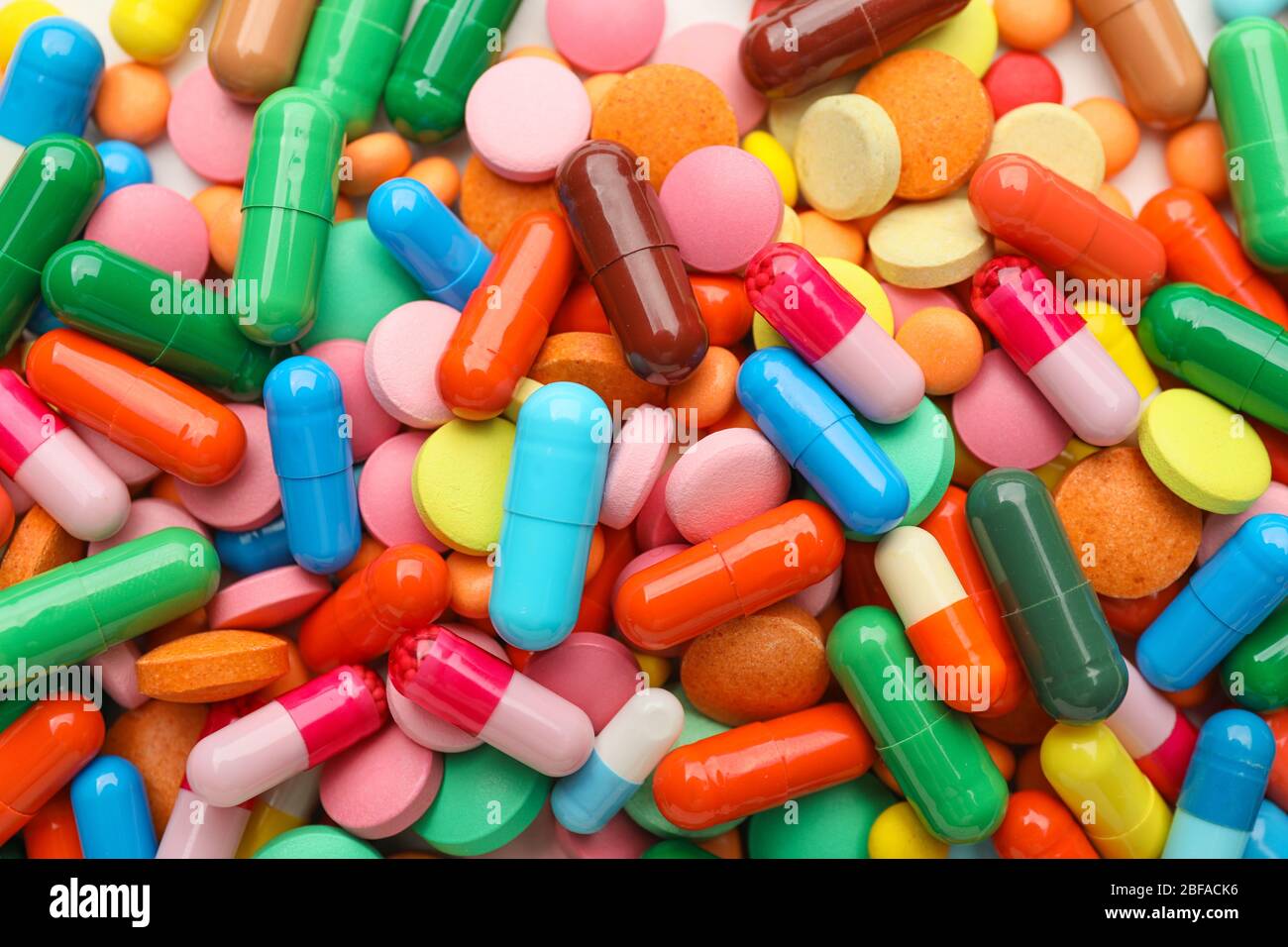 Heap of different pills as background Stock Photo - Alamy