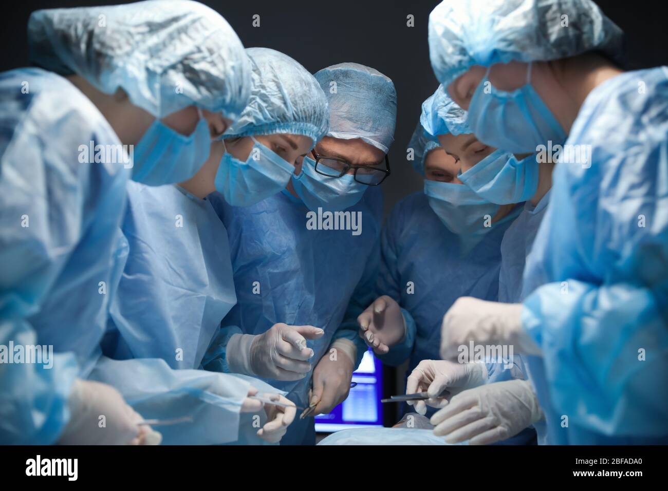 Operating of patient in modern hospital Stock Photo - Alamy
