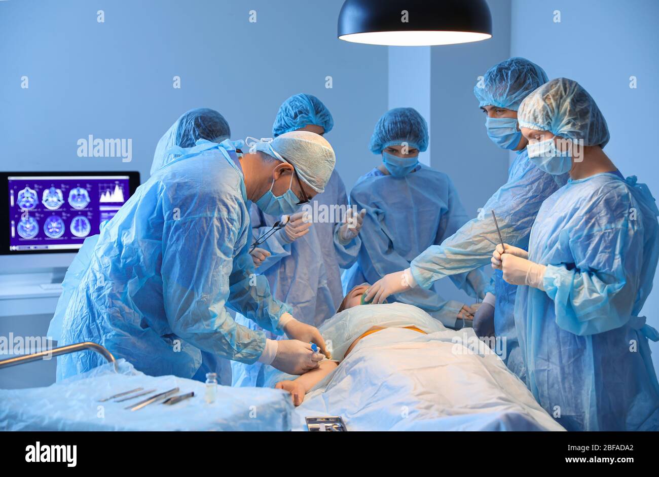 Operating of patient in modern hospital Stock Photo - Alamy