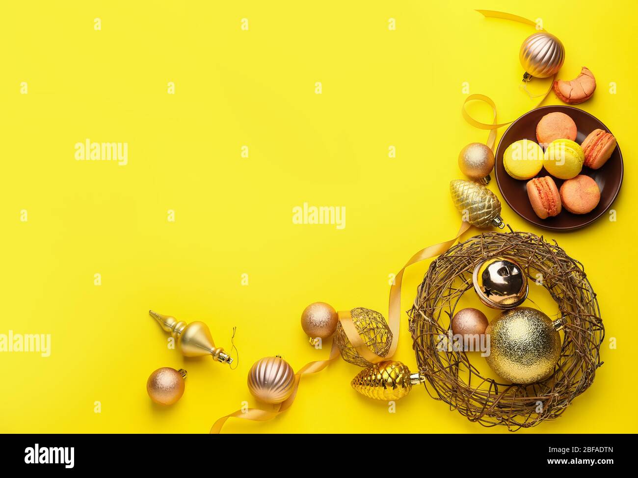 Christmas decor with tasty macarons on color background Stock Photo - Alamy