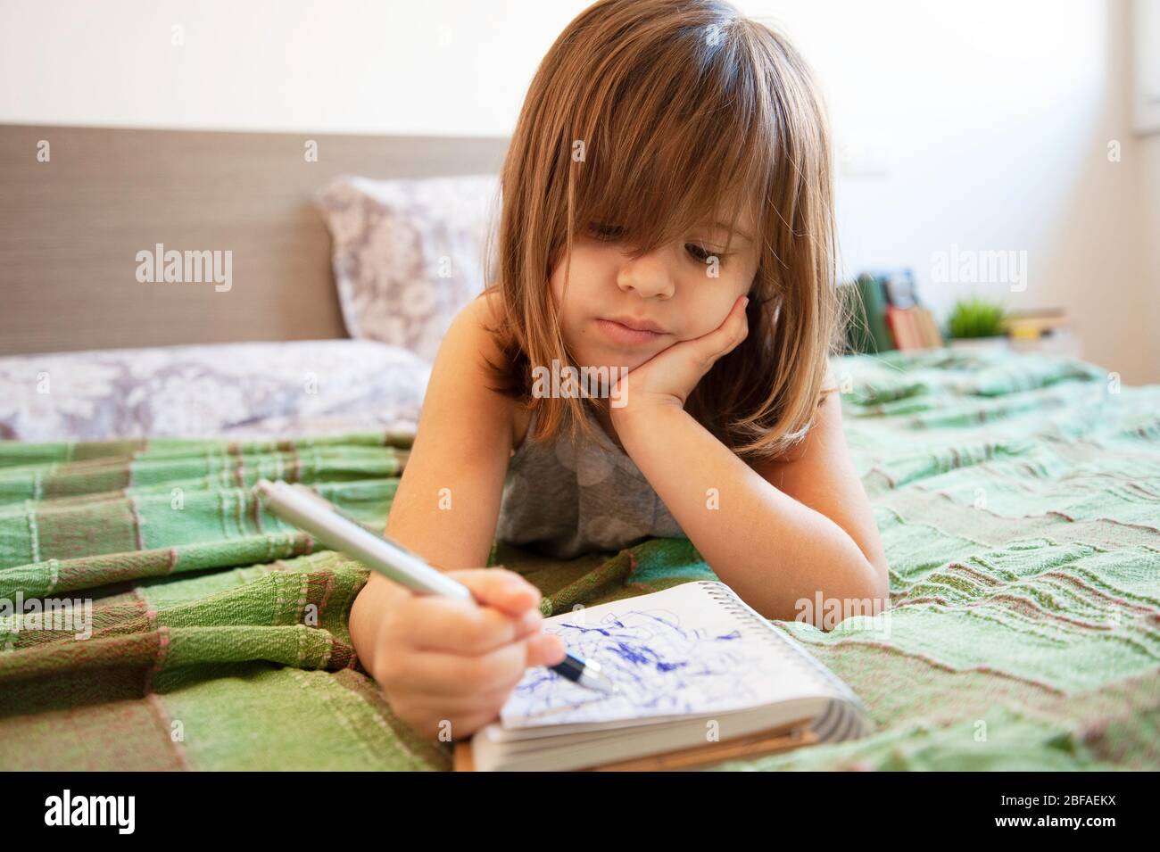 Kid bored in bed hi-res stock photography and images - Alamy