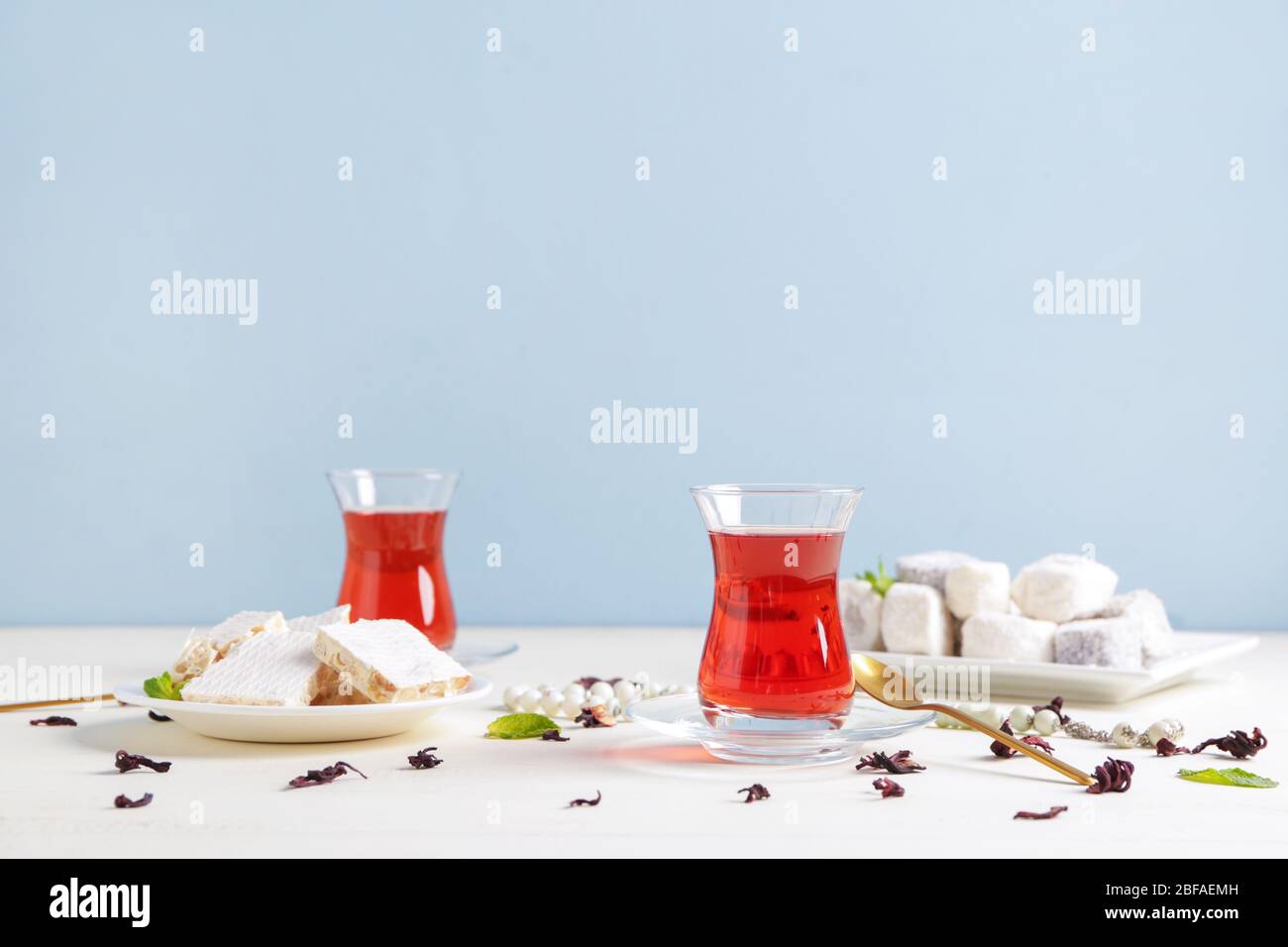Tasty Turkish tea with sweets on table Stock Photo - Alamy