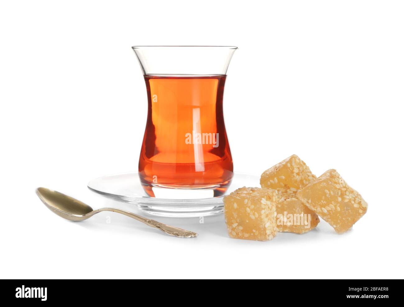 Tasty Turkish tea with sweets on white background Stock Photo - Alamy