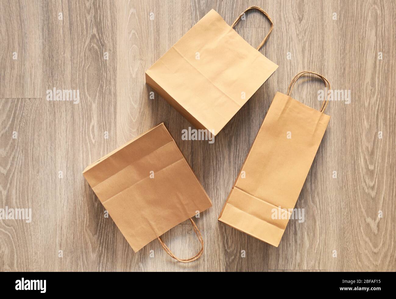 Paper shopping bags on floor, top view Stock Photo - Alamy