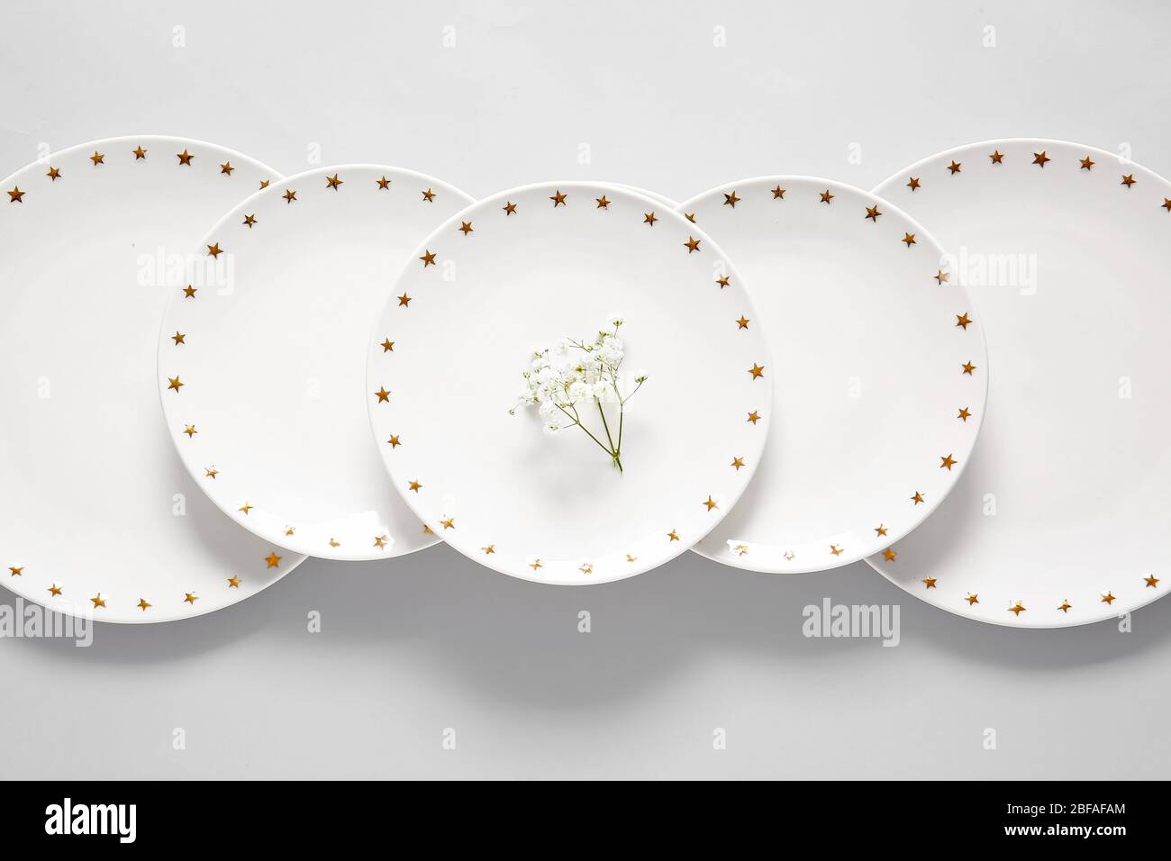 Clean plates on white background Stock Photo - Alamy
