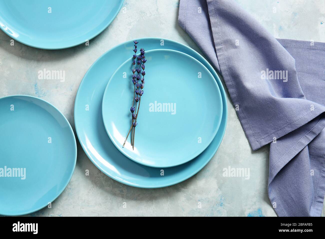 Clean plates on color background Stock Photo - Alamy