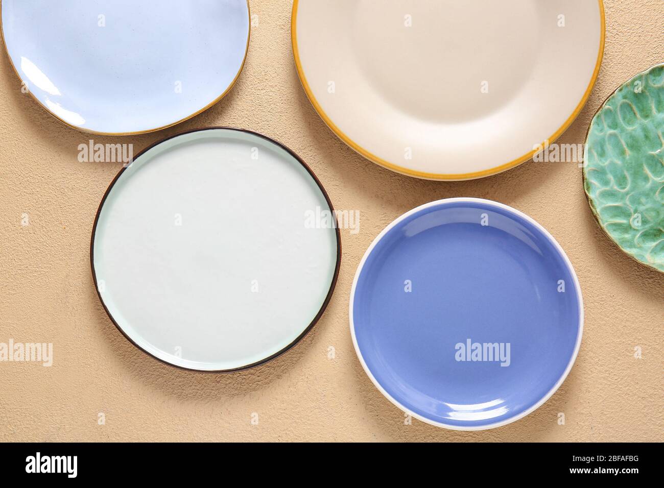 Clean plates on color background Stock Photo - Alamy