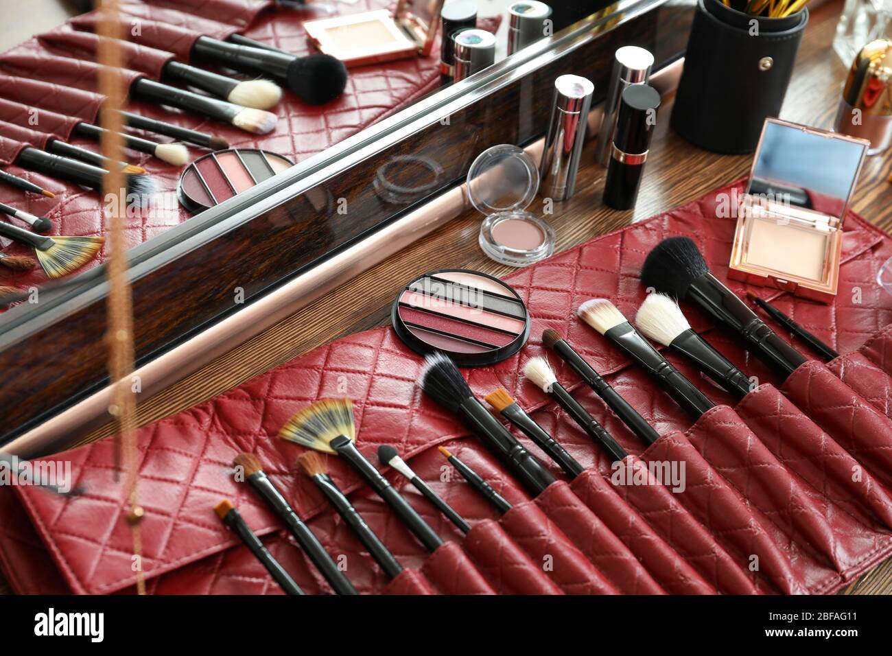 Set of brushes and decorative cosmetics on table of makeup artist Stock ...