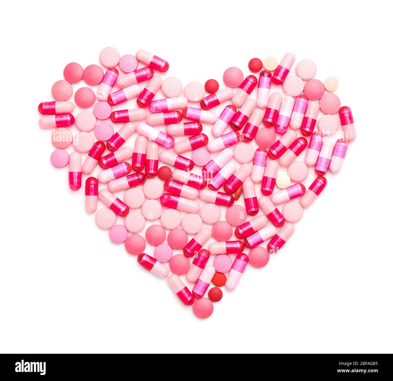 Heart made of pills on white background Stock Photo - Alamy