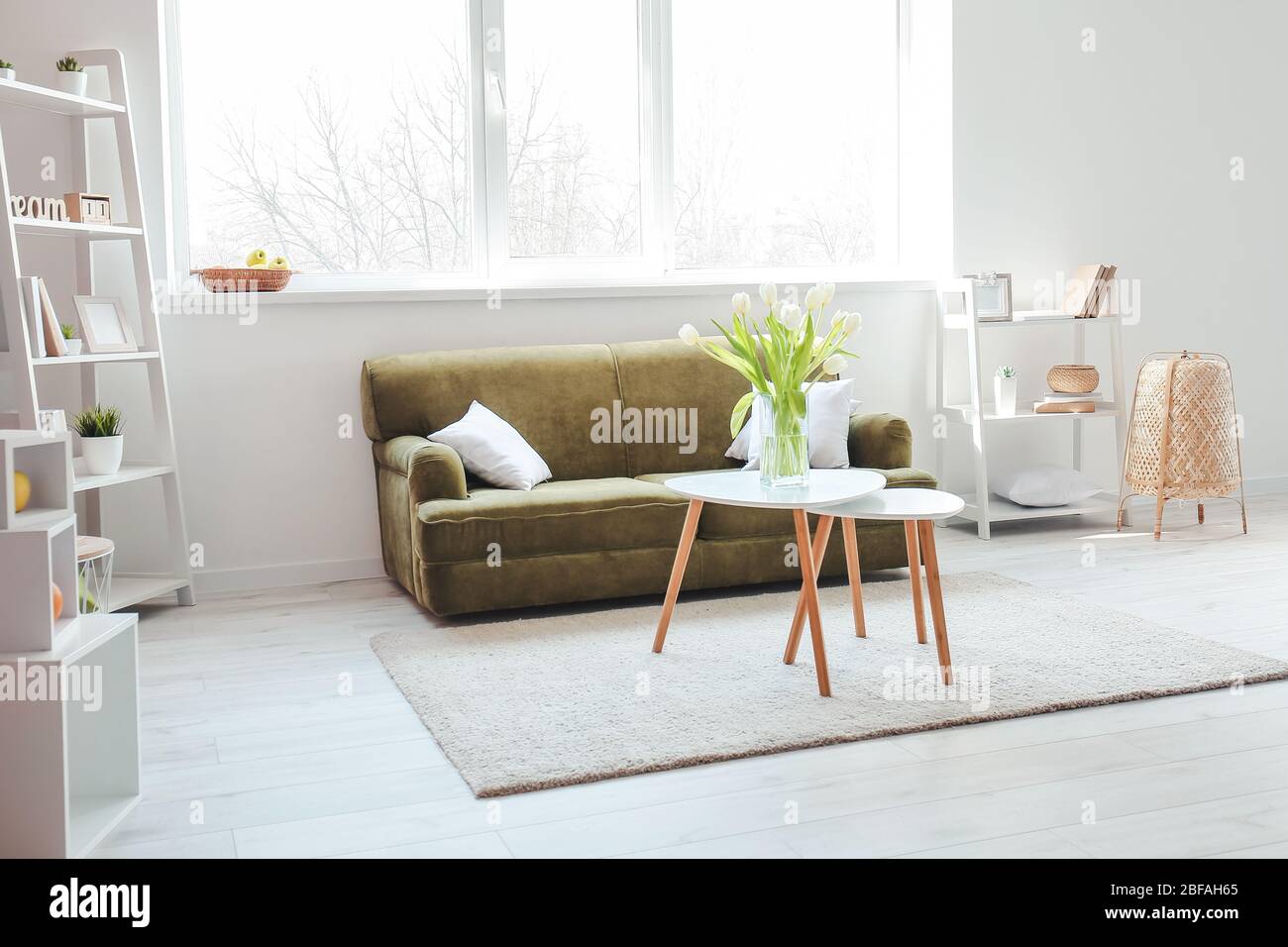 Interior of modern room with comfortable sofa Stock Photo - Alamy