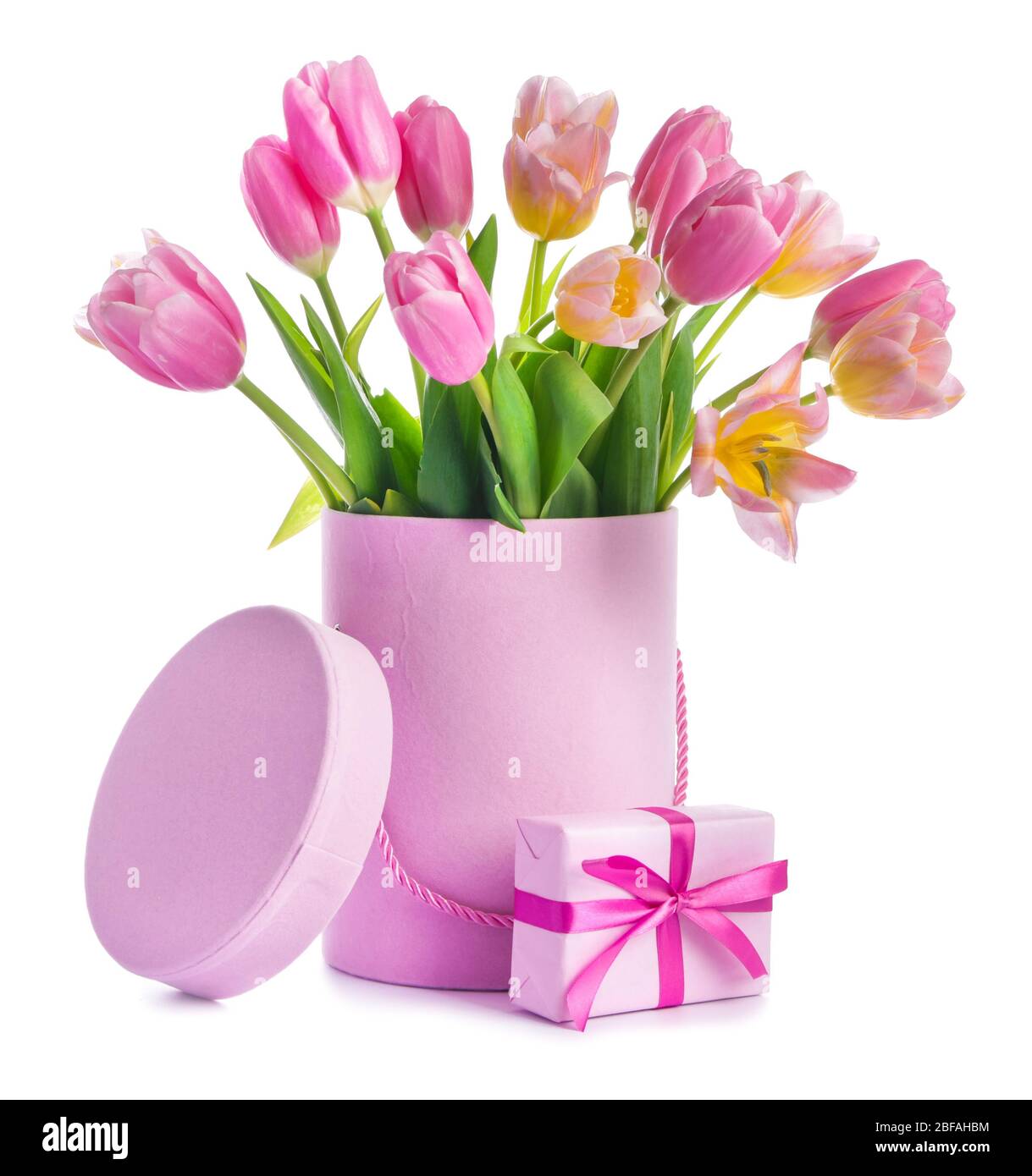 Gift box and beautiful flowers on white background Stock Photo - Alamy