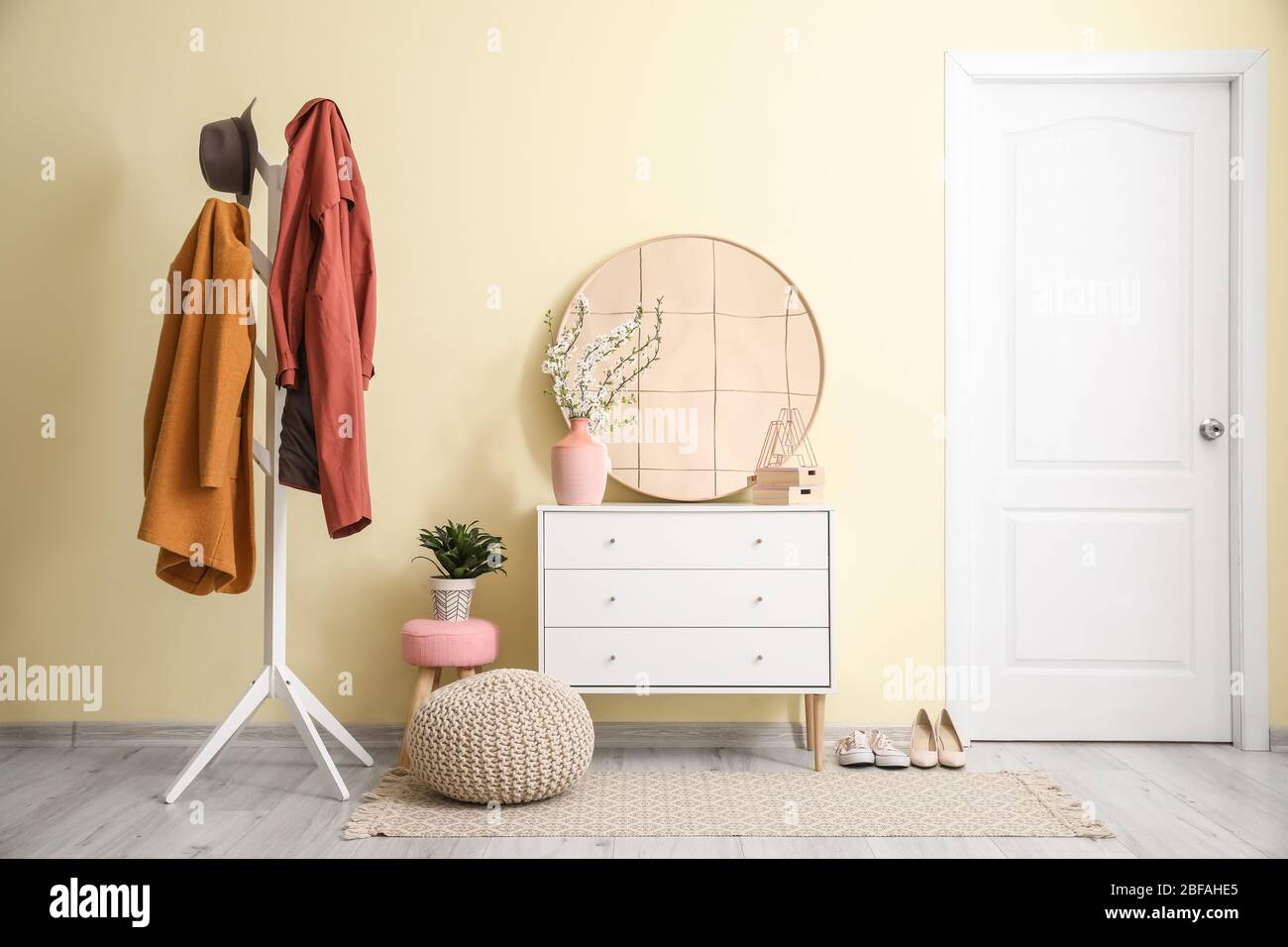 Stylish interior of modern hall with spring clothes Stock Photo - Alamy