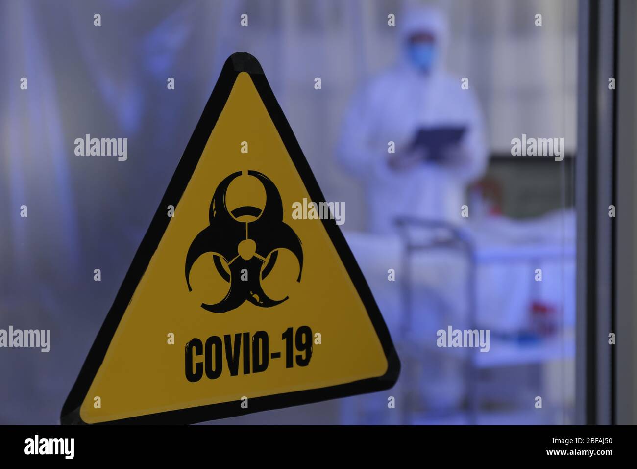 Biohazard warning sign on door of contagious isolation ward. Concept of ...