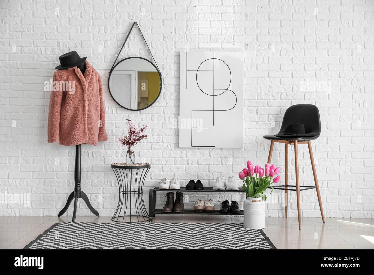 Stylish interior of modern hall with spring flowers Stock Photo - Alamy