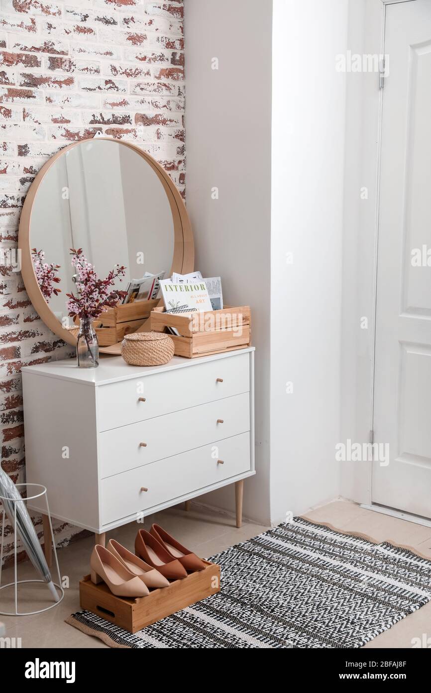 Stylish interior of modern hall with spring flowers Stock Photo - Alamy