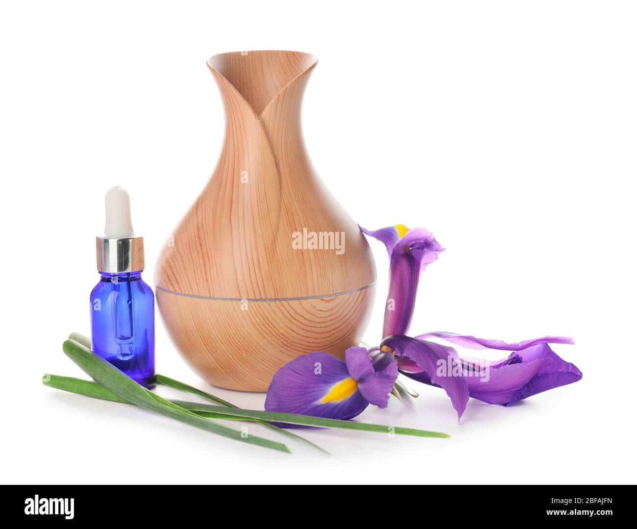 Aroma oil diffuser and flower on white background Stock Photo - Alamy