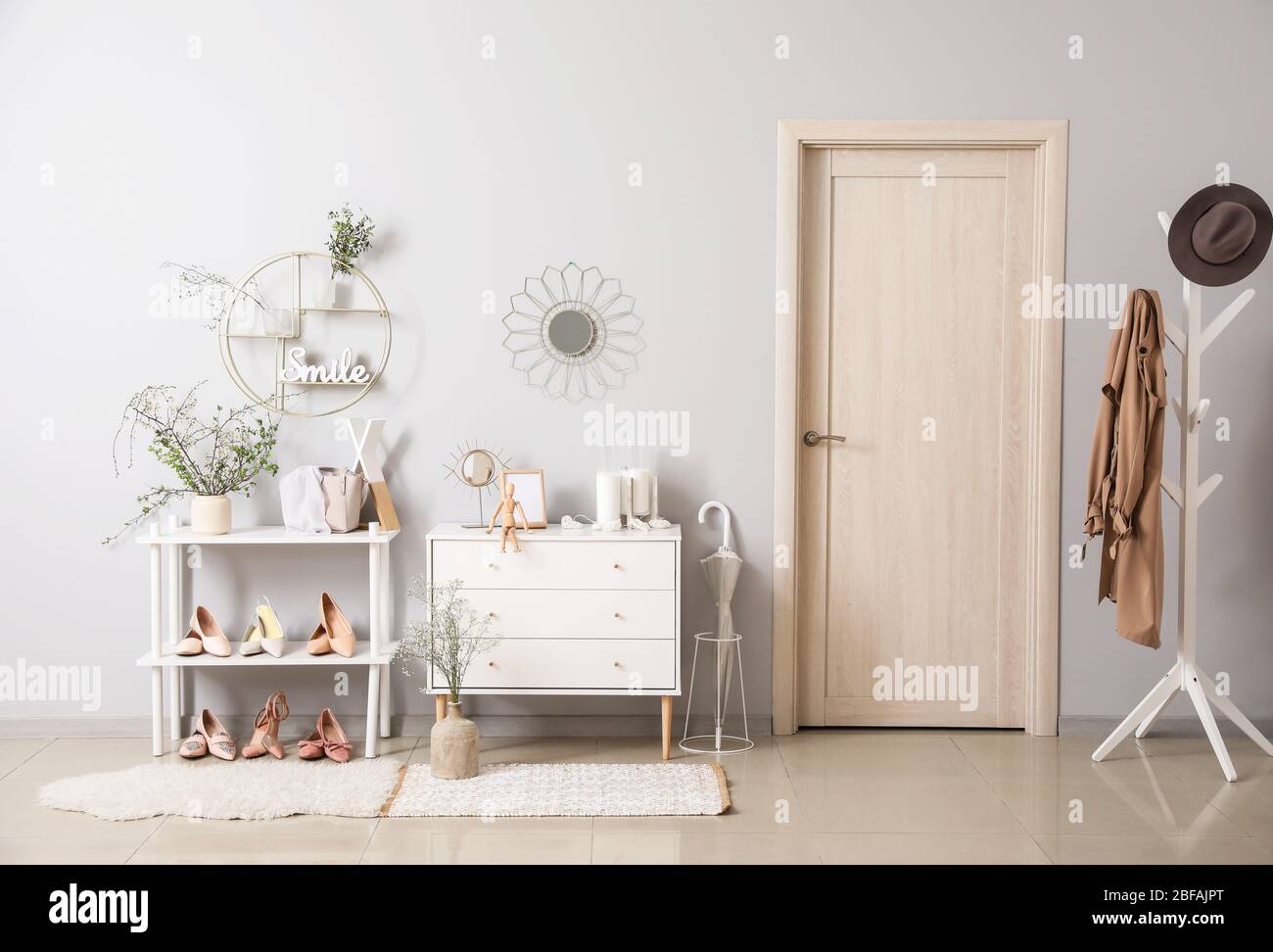 Stylish interior of modern hall with spring flowers Stock Photo - Alamy