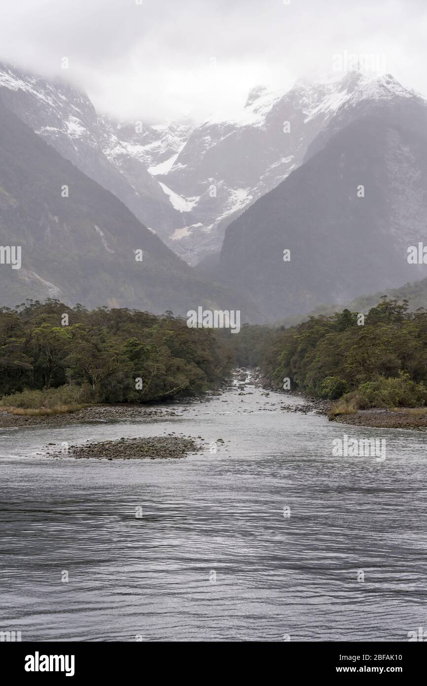 landscape with river estuary at fjord shore, shot in cloudy bright ...