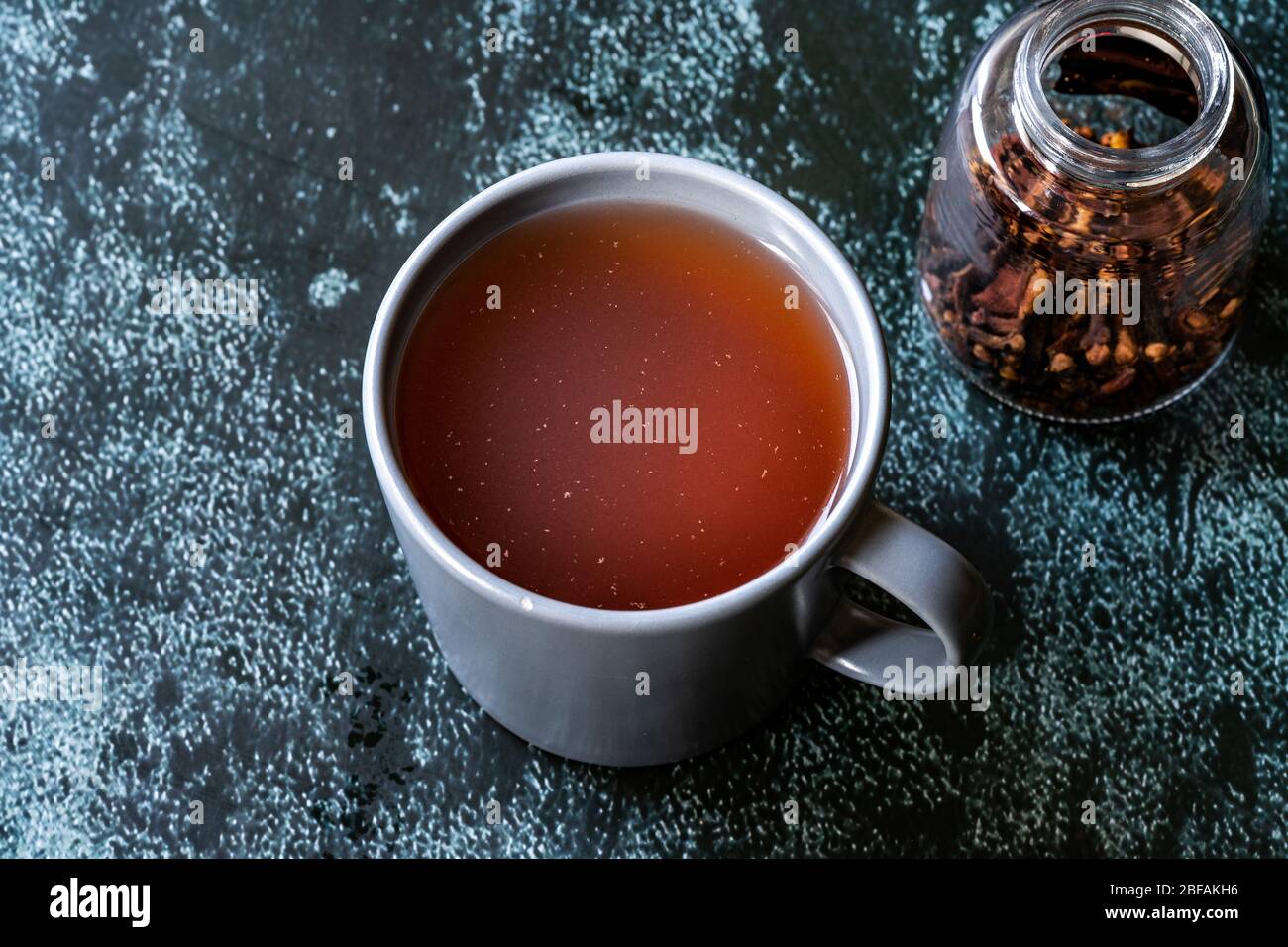 Sumac water or tea and dried ground red Sumac spices with cloves in ...