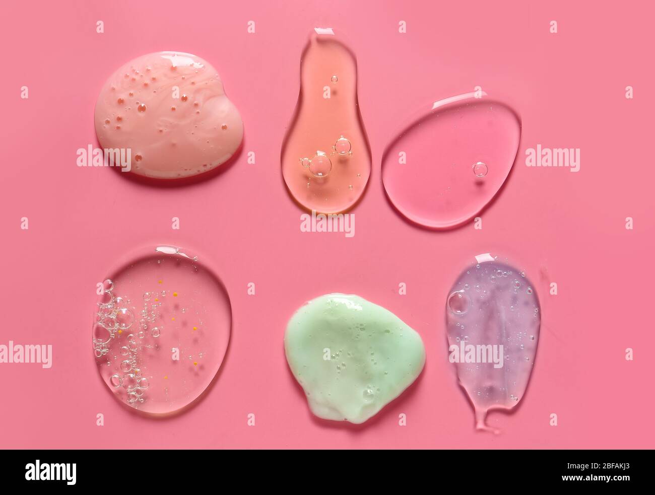 Shower gels on color background Stock Photo - Alamy