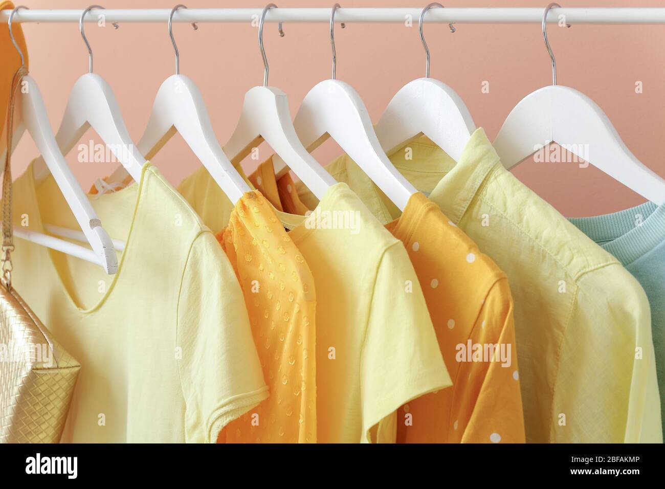 Modern clothes hanging on rack, closeup Stock Photo - Alamy