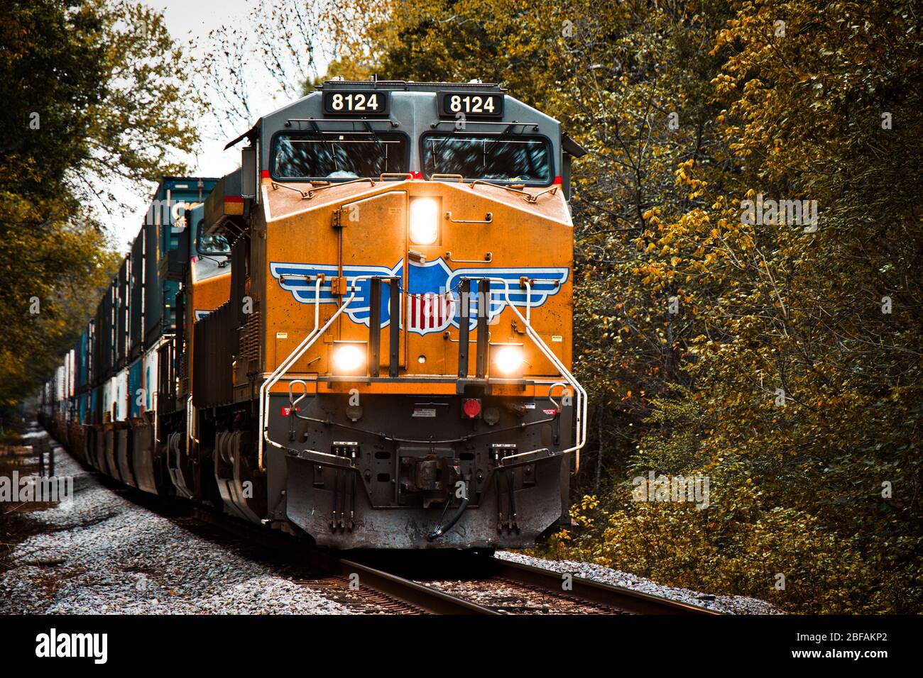 Yellow Train on the Tracks Stock Photo - Alamy