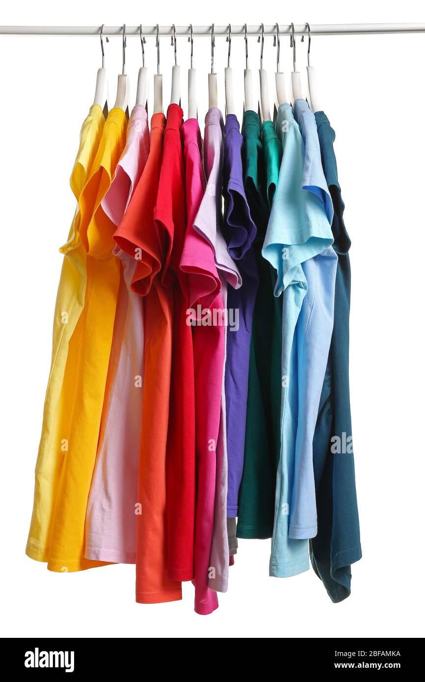 Rack with hanging clothes on white background Stock Photo - Alamy