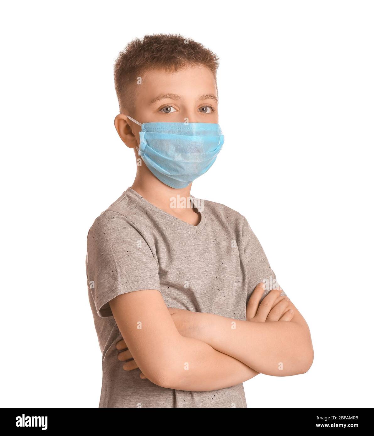 Little boy wearing protective mask against white background. Concept of ...