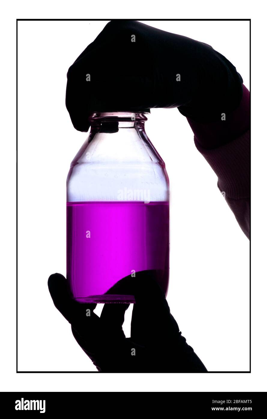 Close up of coloured liquid in bottle Stock Photo - Alamy