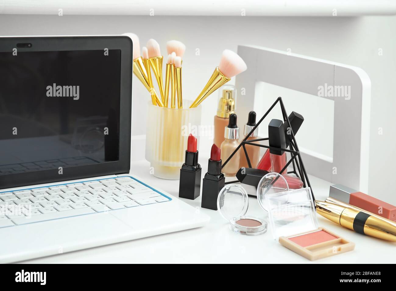 Workplace of professional makeup artist with laptop Stock Photo - Alamy