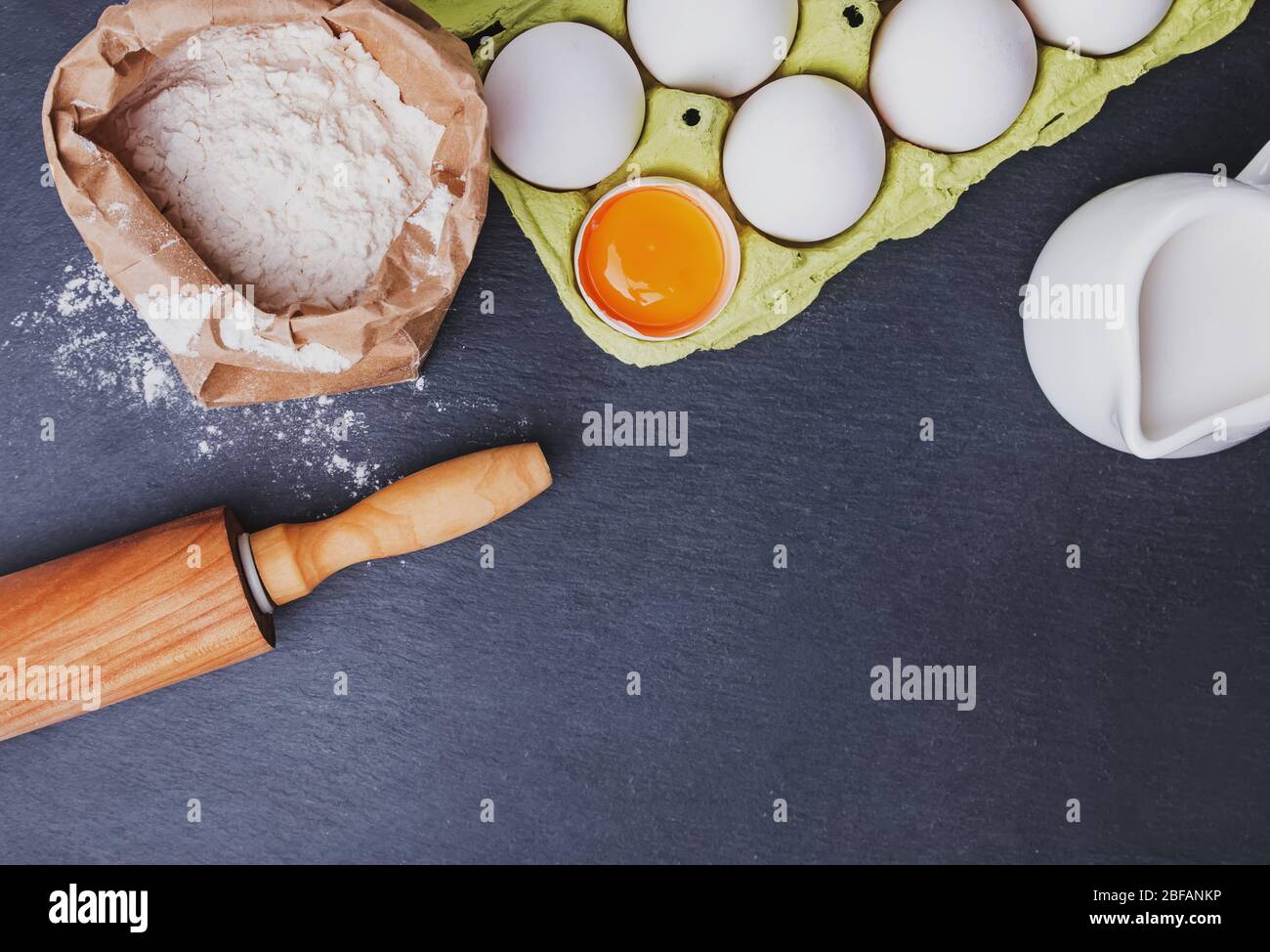 Ingredients for bakery on black stone background Stock Photo - Alamy