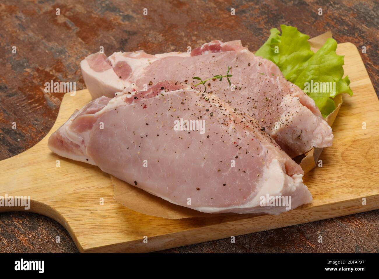 Raw pork meat steak ready for grill Stock Photo - Alamy