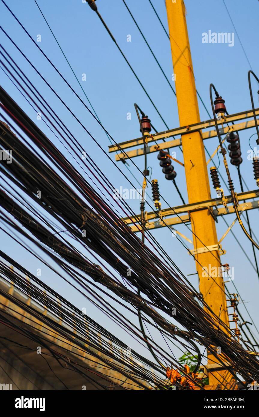 Overhead electric and telephone wires in Bangkok in Thailand Stock ...