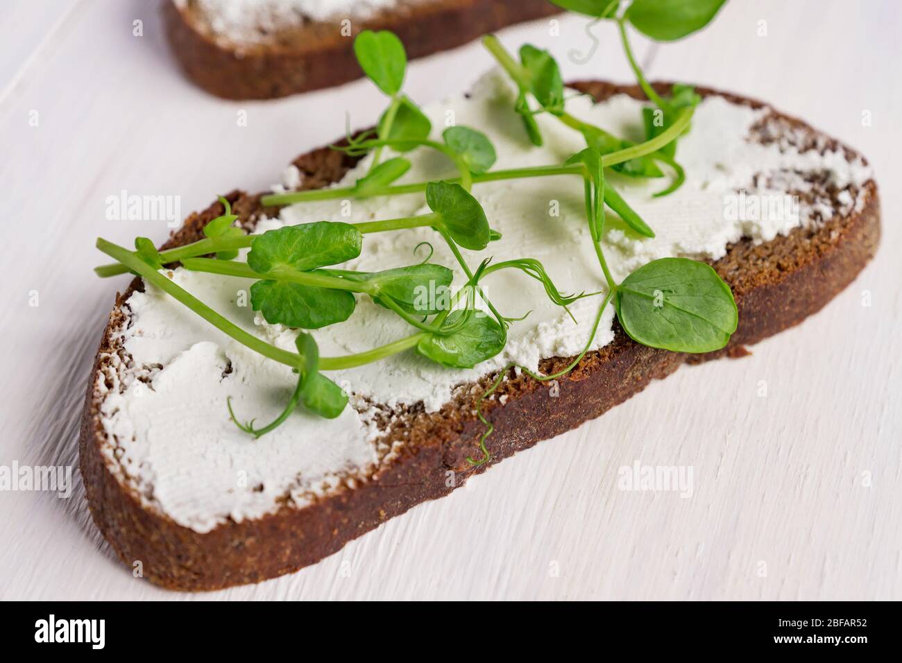 Healthy macrobiotic breakfast. Sandwich with cream cheese and peas ...