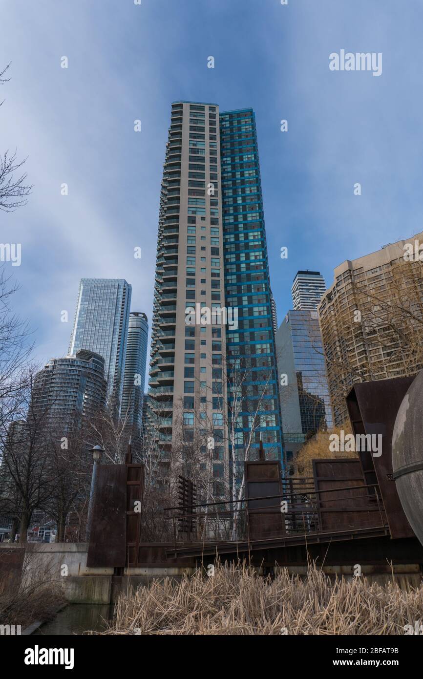 Day time exterior establishing shot of high rise luxury apartment ...