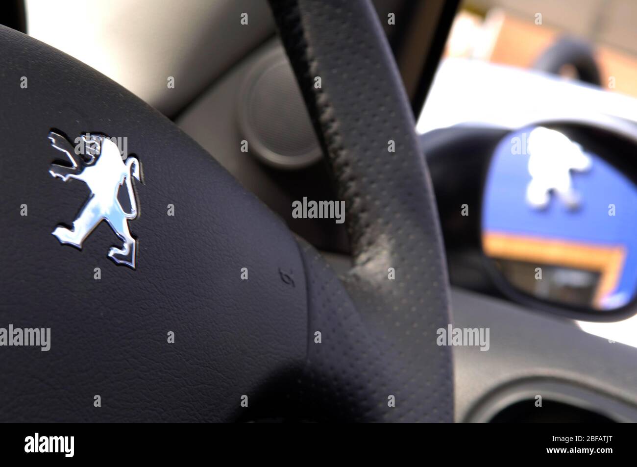 The branded steering wheel inside a Peugeot car Stock Photo - Alamy