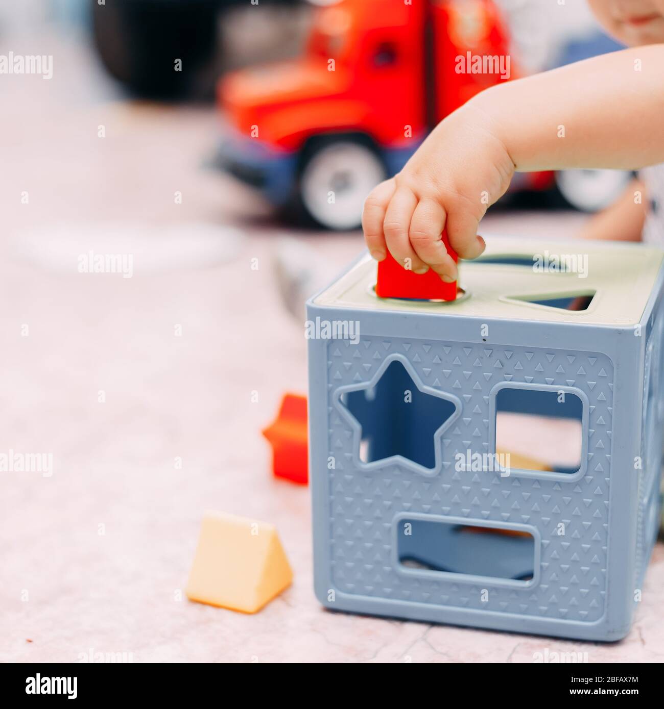Child playing with shape sorter hi-res stock photography and images - Alamy