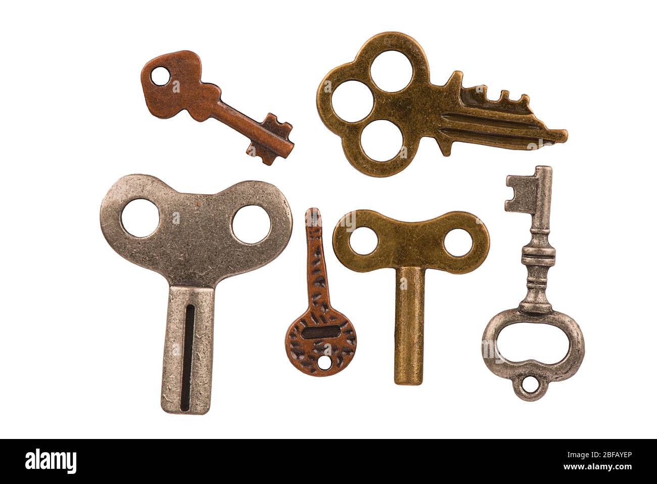 Closeup on a set of old keys, isolated on white background. Cut out ...