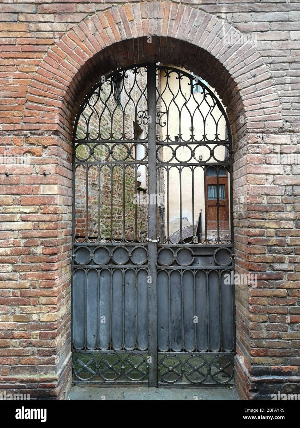 Ancient iron gate of an ancient Italian villa Stock Photo - Alamy