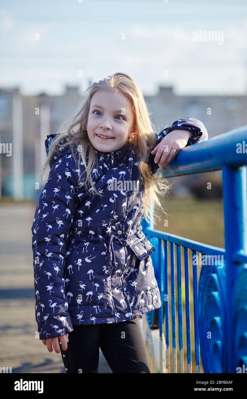 Beautiful cute little girl with a grimace on her face, happy childhood ...