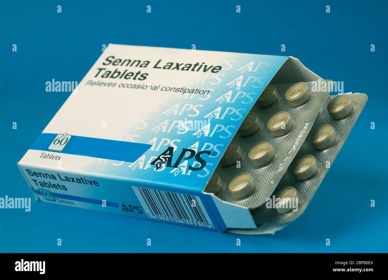 An open pack of Senna Laxative Tablets against a blue background Stock ...