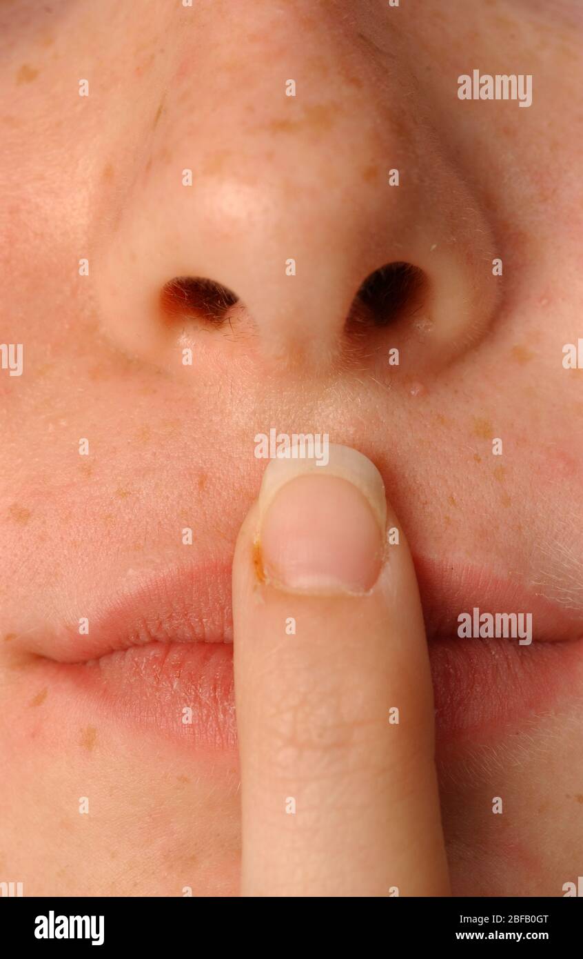 Girl finger pressed lips hi-res stock photography and images - Alamy