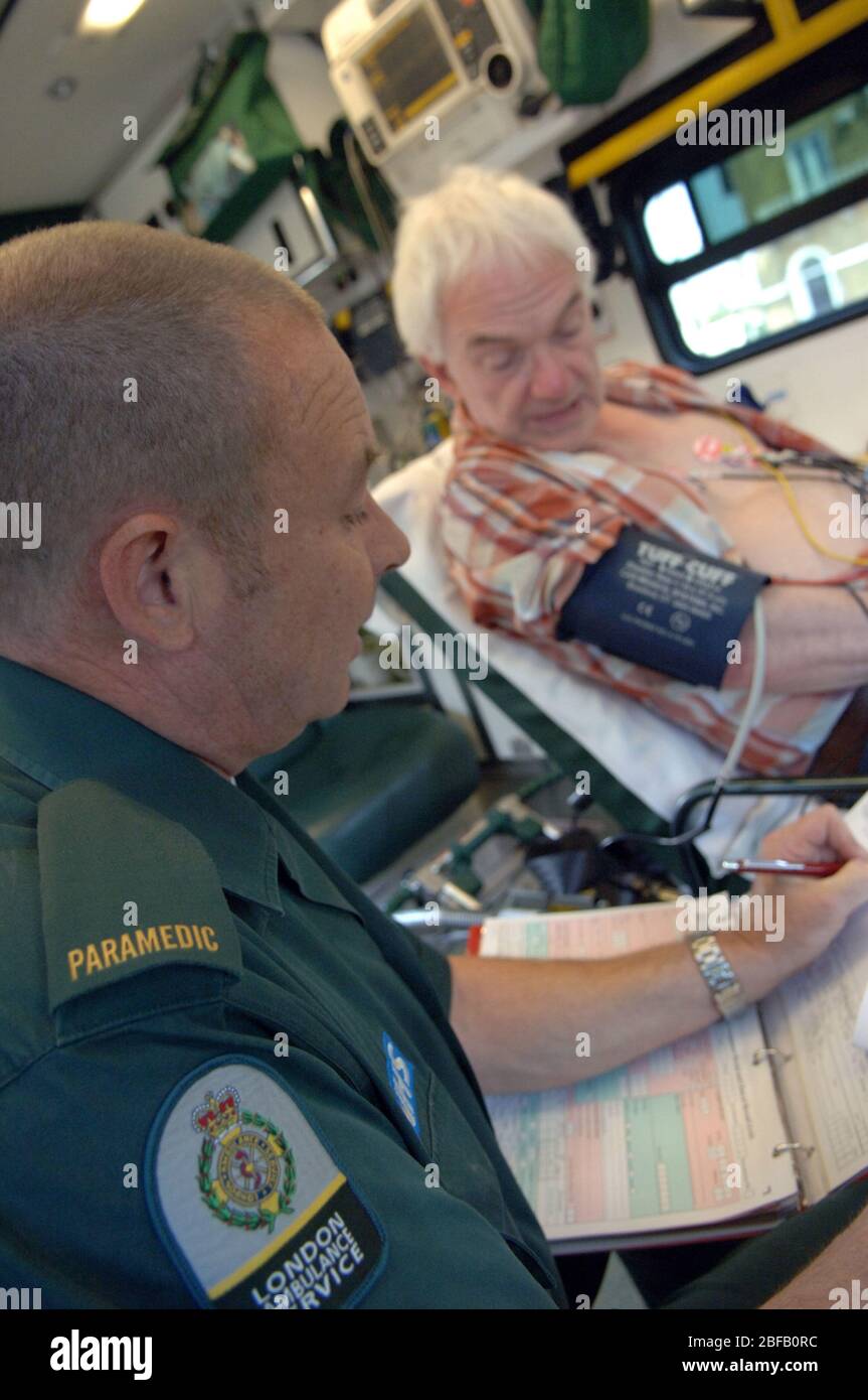 Paramedic taking notes from patient.(Model released Stock Photo - Alamy