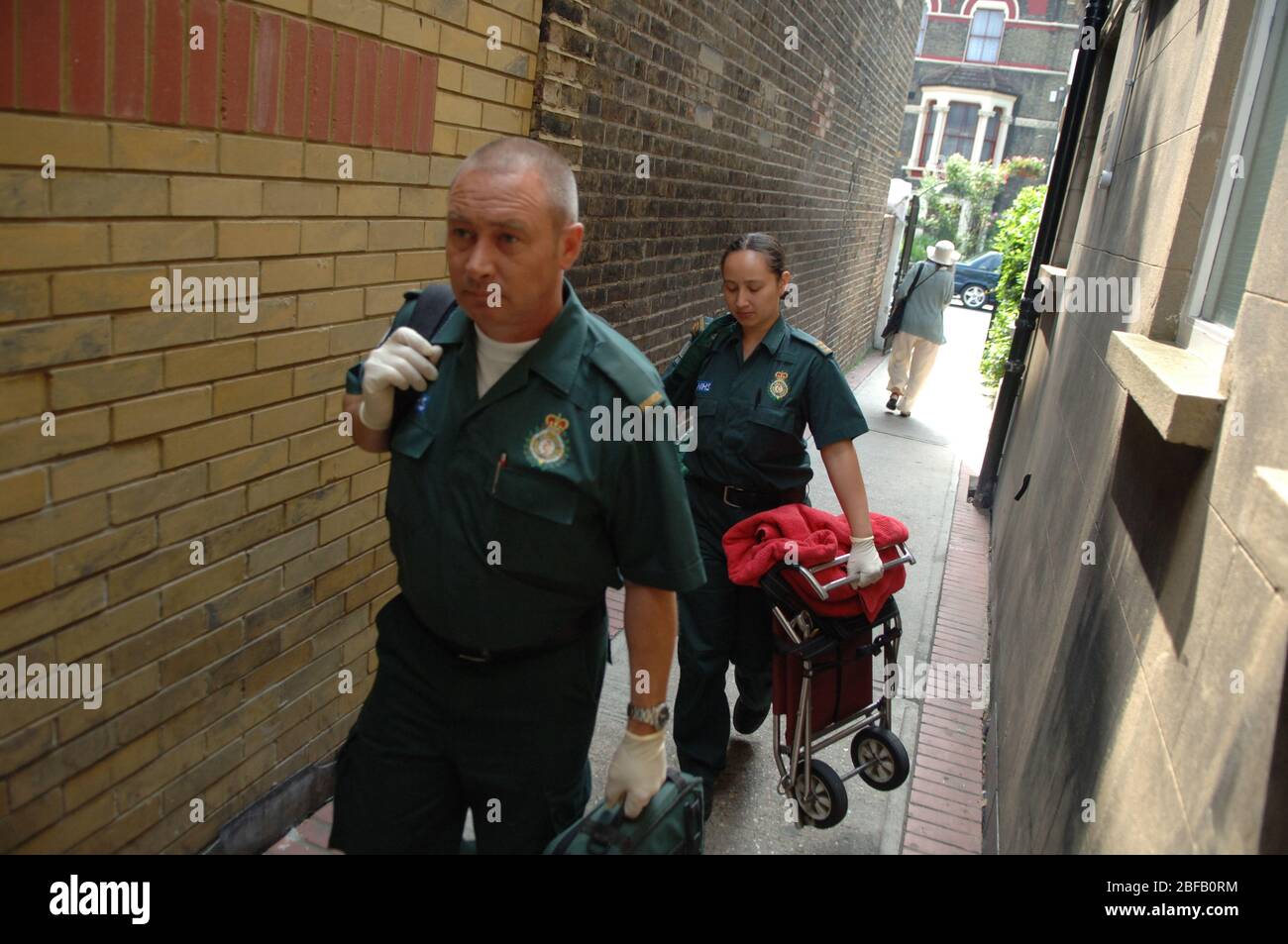 Paramedic and ambulance technician walking to a emergency scene Stock ...