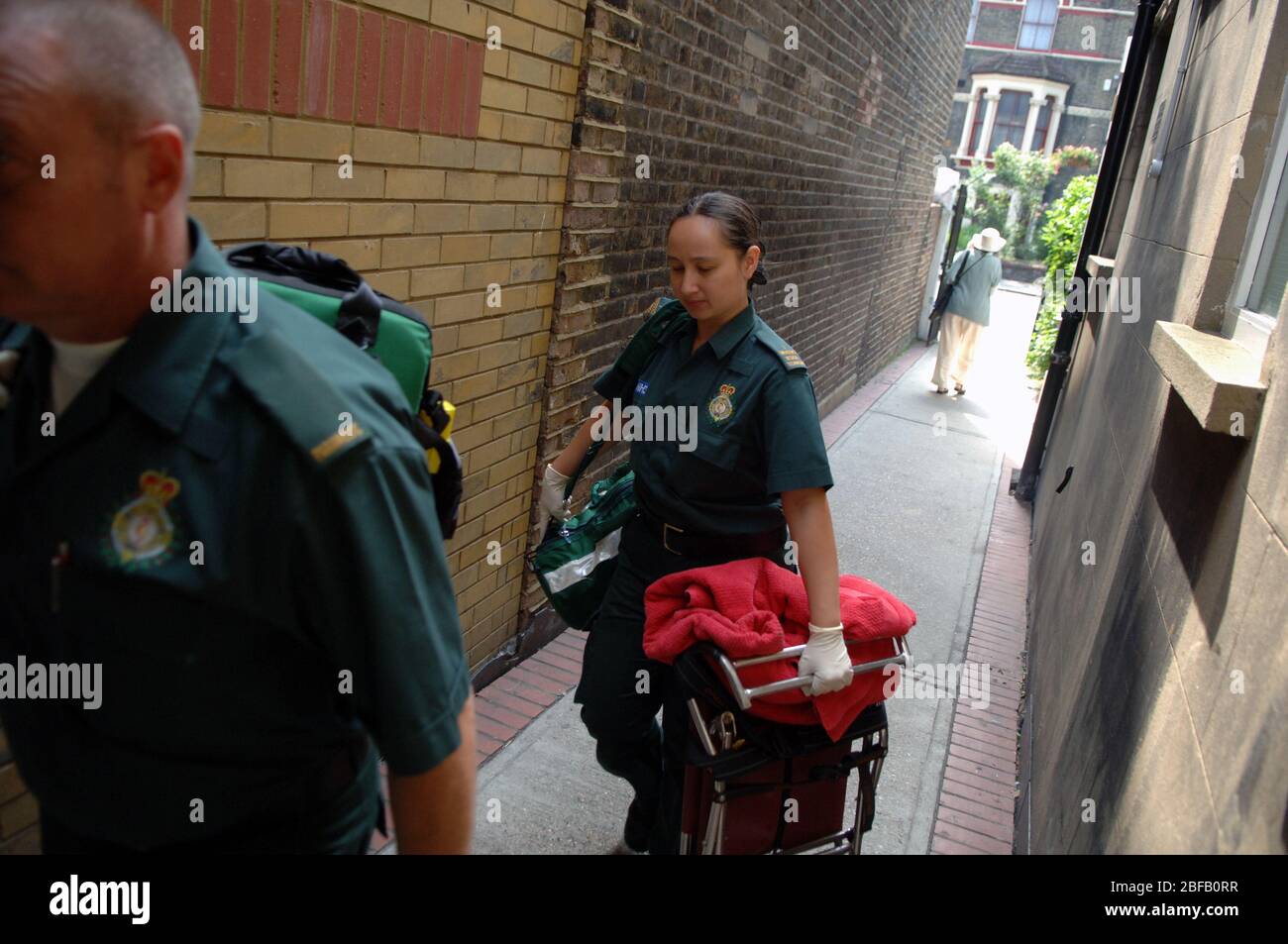 Paramedic and ambulance technician walking to a emergency scene Stock ...