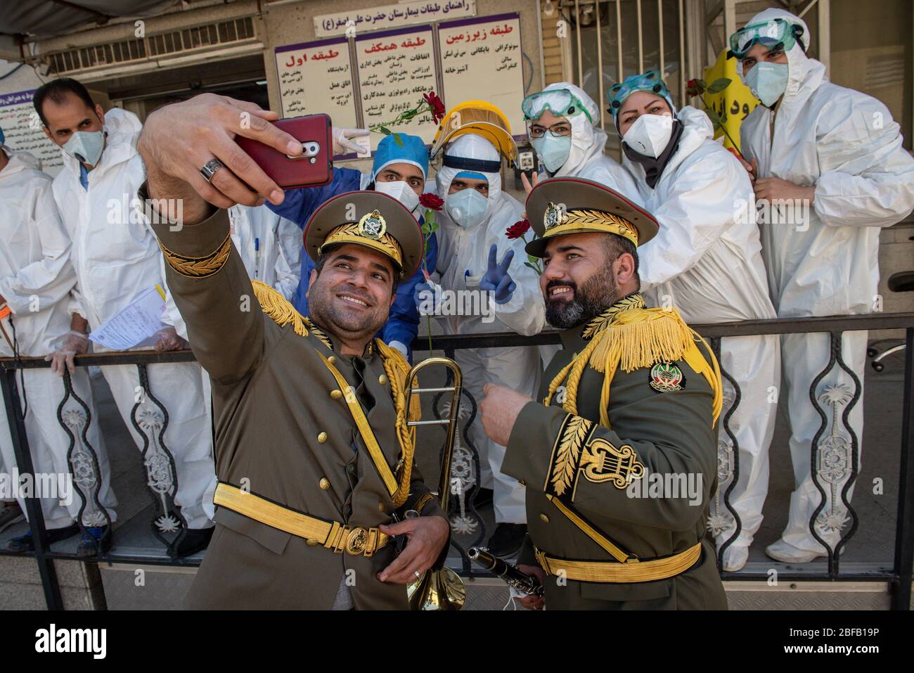 The officer of Iranian Army is taking selfie with Nurses and Doctors of ...
