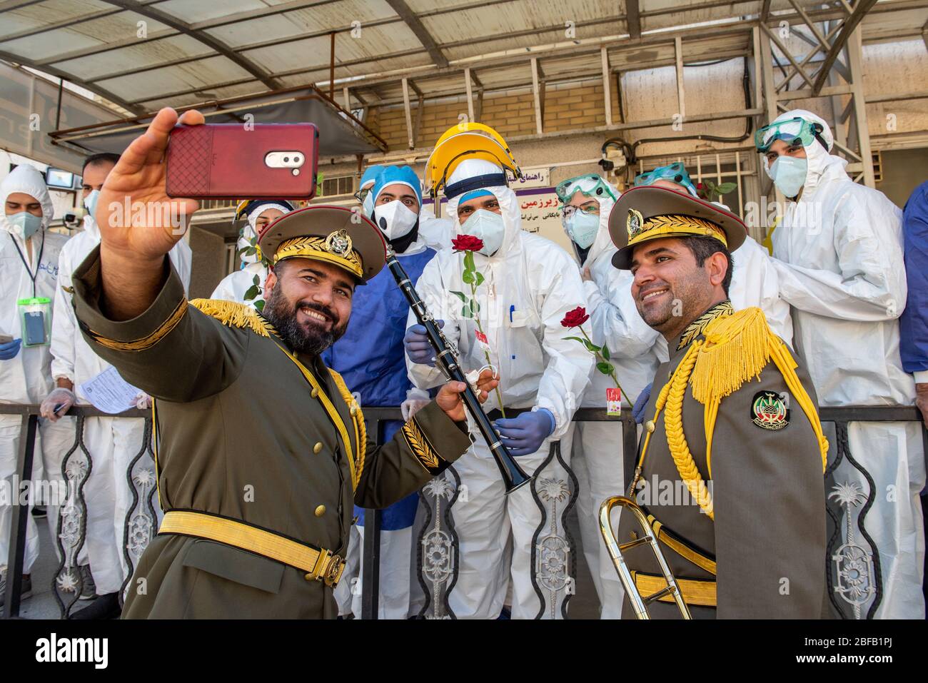 The officer of Iranian Army is taking selfie with Nurses and Doctors of ...