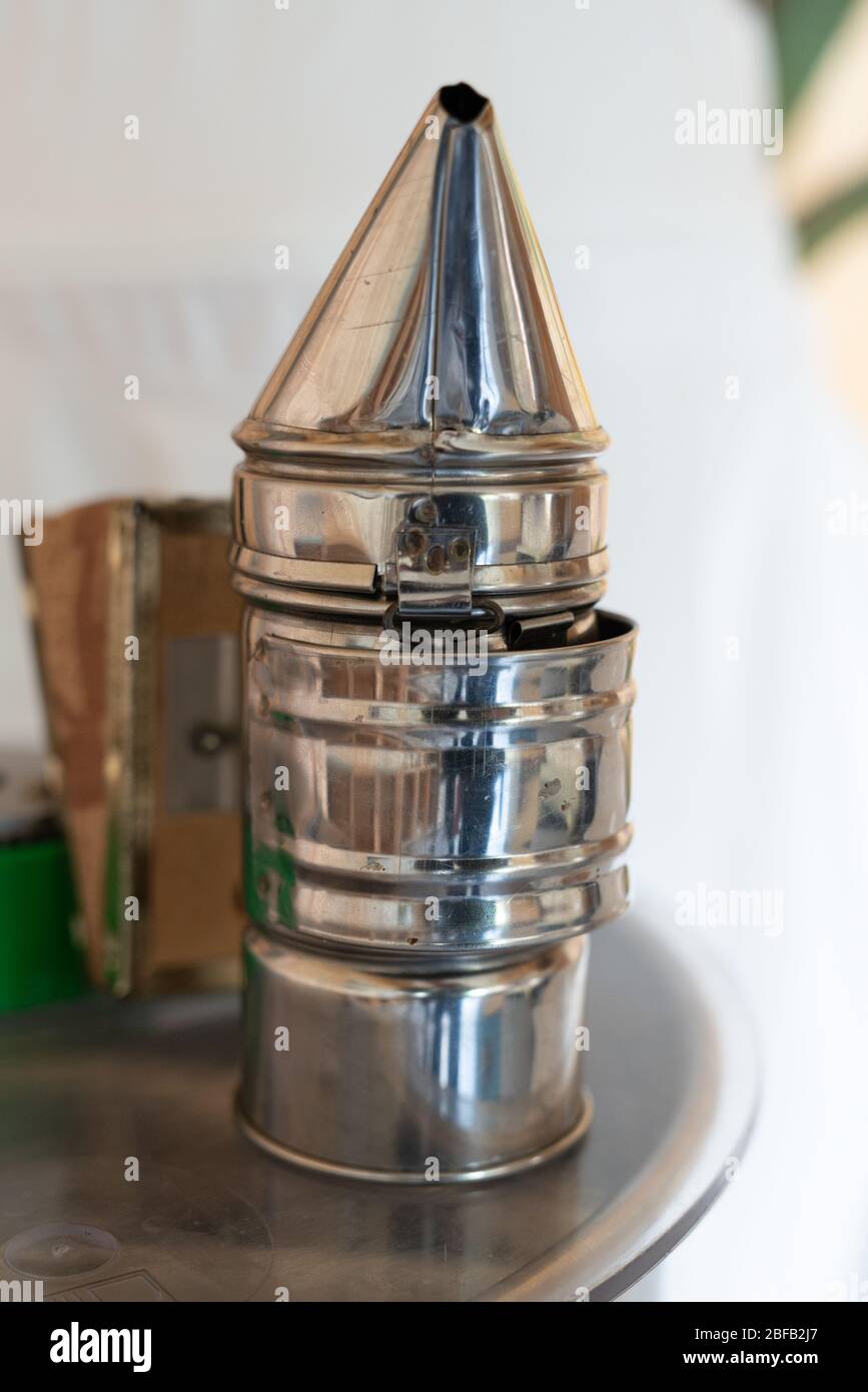 steel Bee smoker a beekeeping tool apiary Stock Photo - Alamy